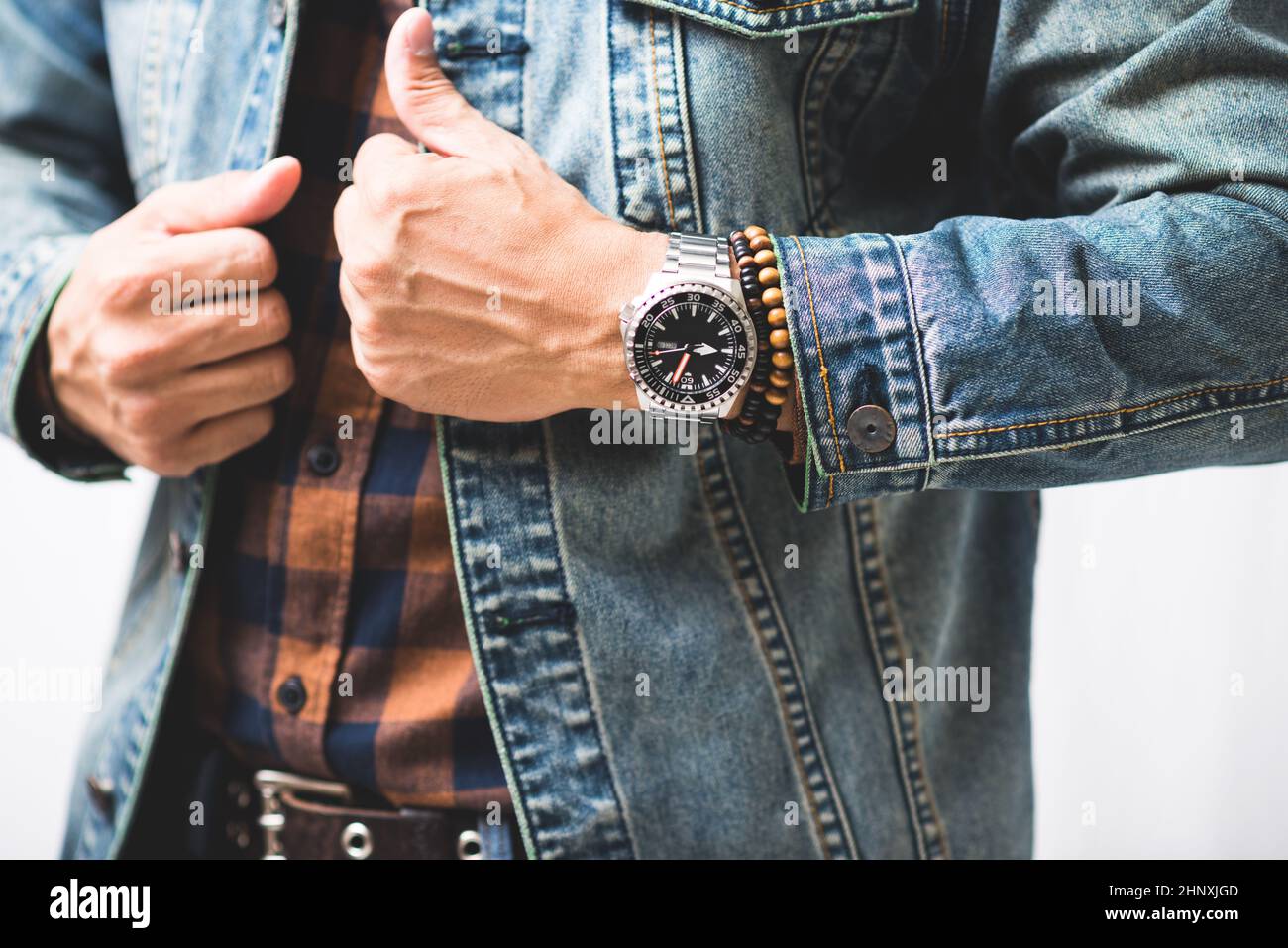 closeup luxury men watch with black dial and stainless steel bracelet ...