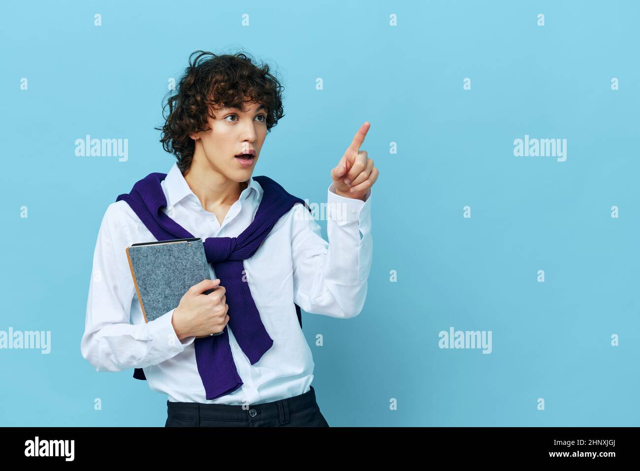 guy with a notepad in a sweater shirt on the shoulders isolated ...