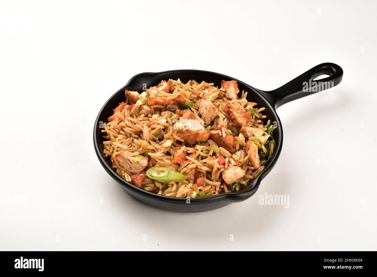 pan full of chicken fried rice isolated on white background with ...