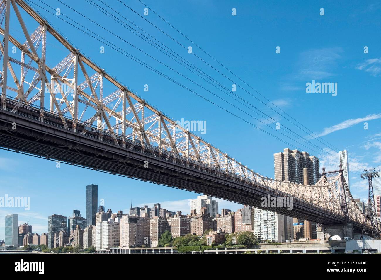 exterior of Queensboro bridge and tramway cable against Manhattan ...
