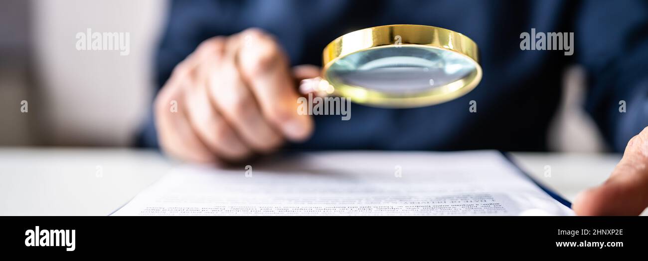 Auditor Using Magnifying Glass For Audit And Fraud Investigation Stock ...