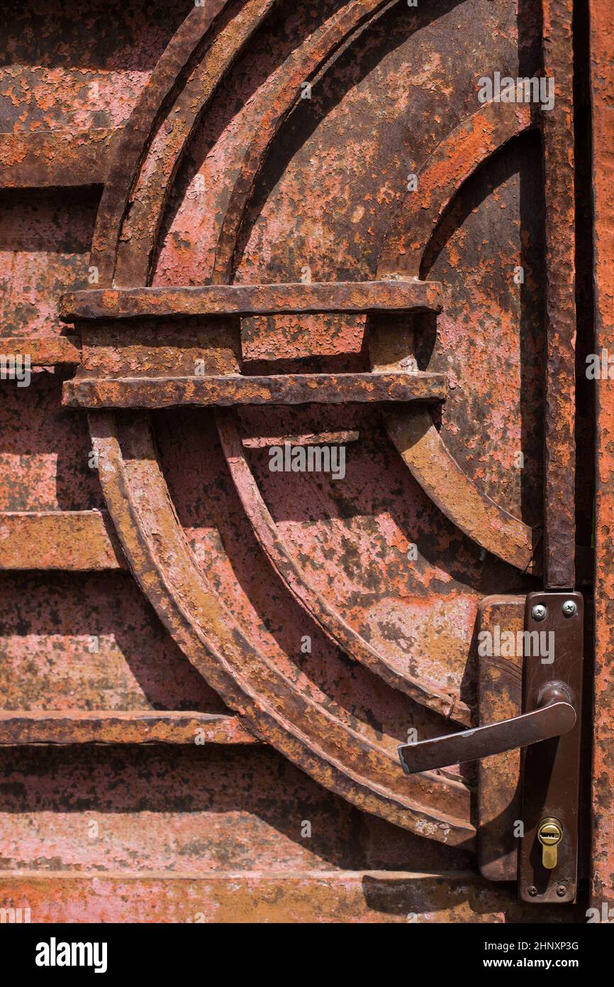 Rusty iron door with handle and lock Stock Photo - Alamy