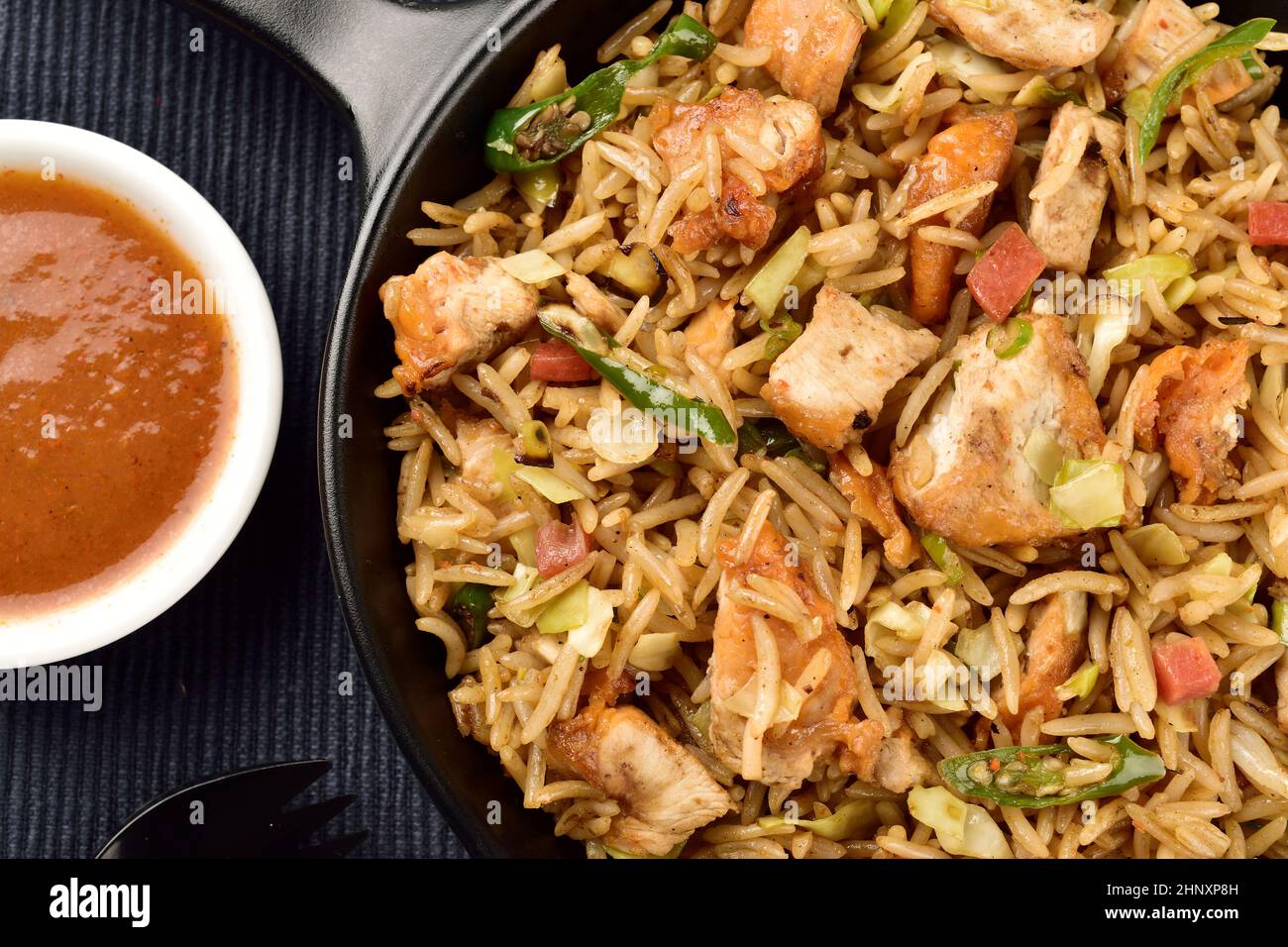 chicken fried rice with chilli sauce Stock Photo - Alamy
