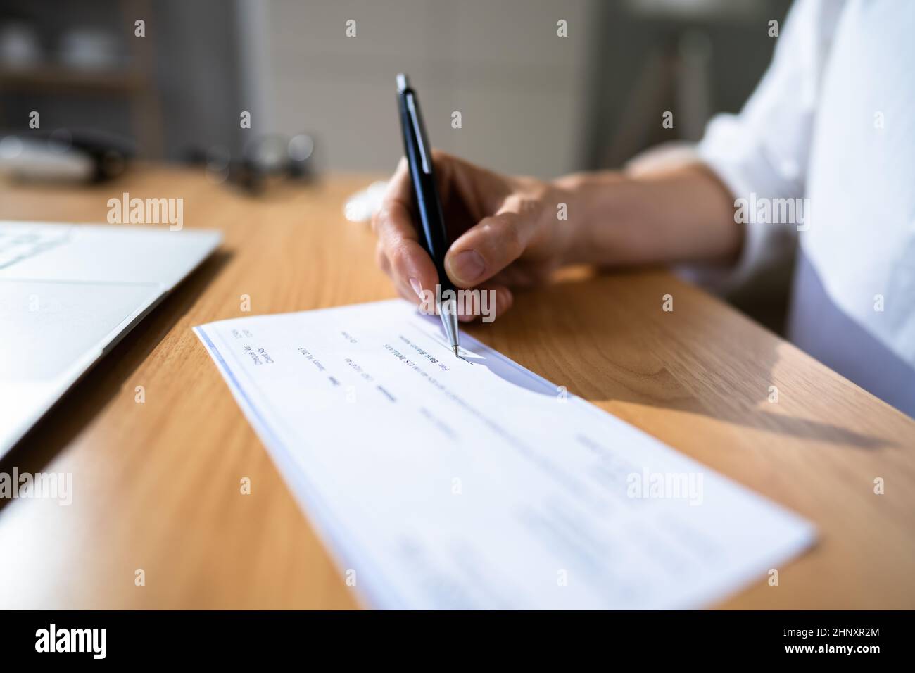 Cashier bank cheque hi-res stock photography and images - Alamy