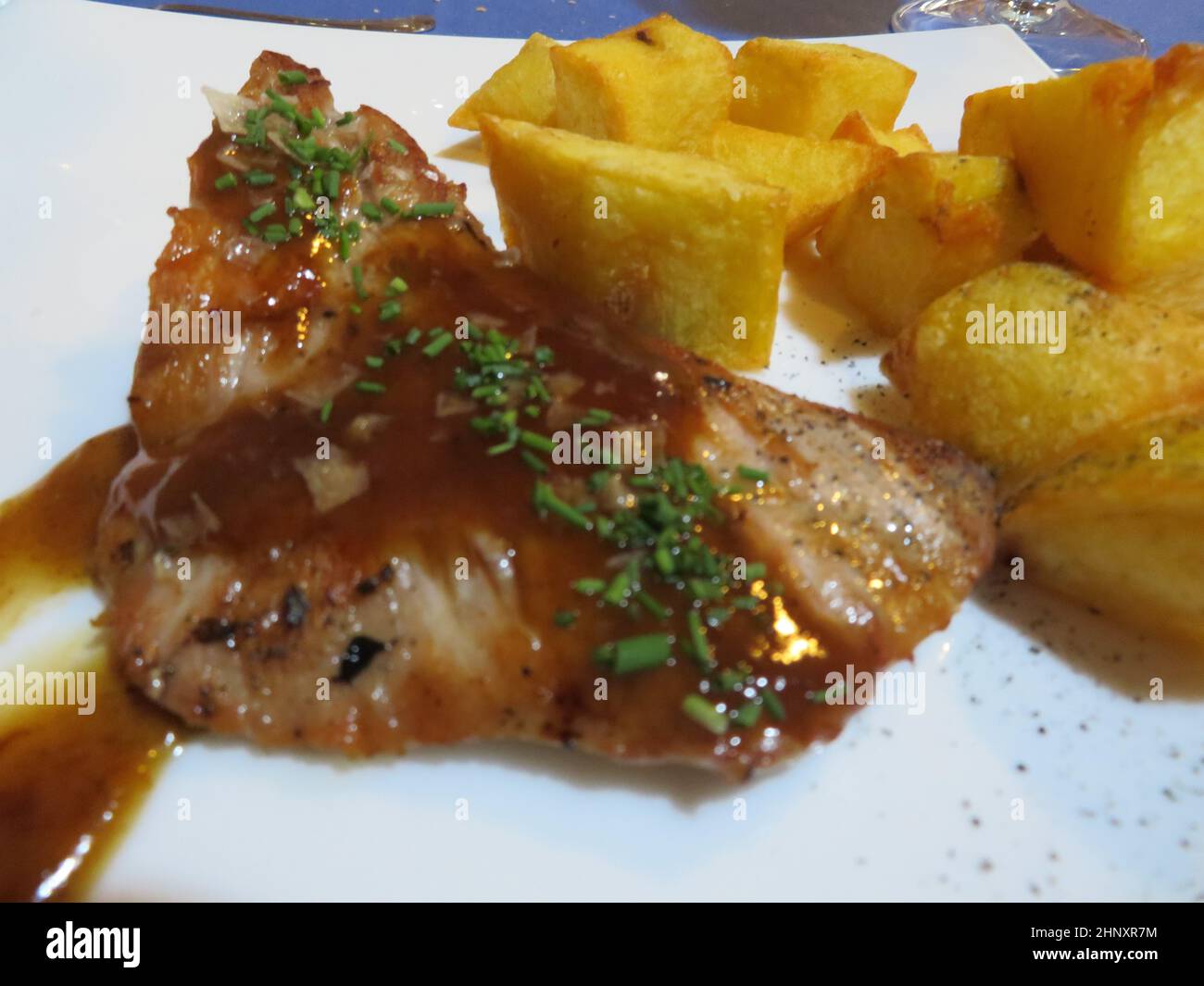 delicious Iberian secret with fries in port sauce luxury food Stock ...