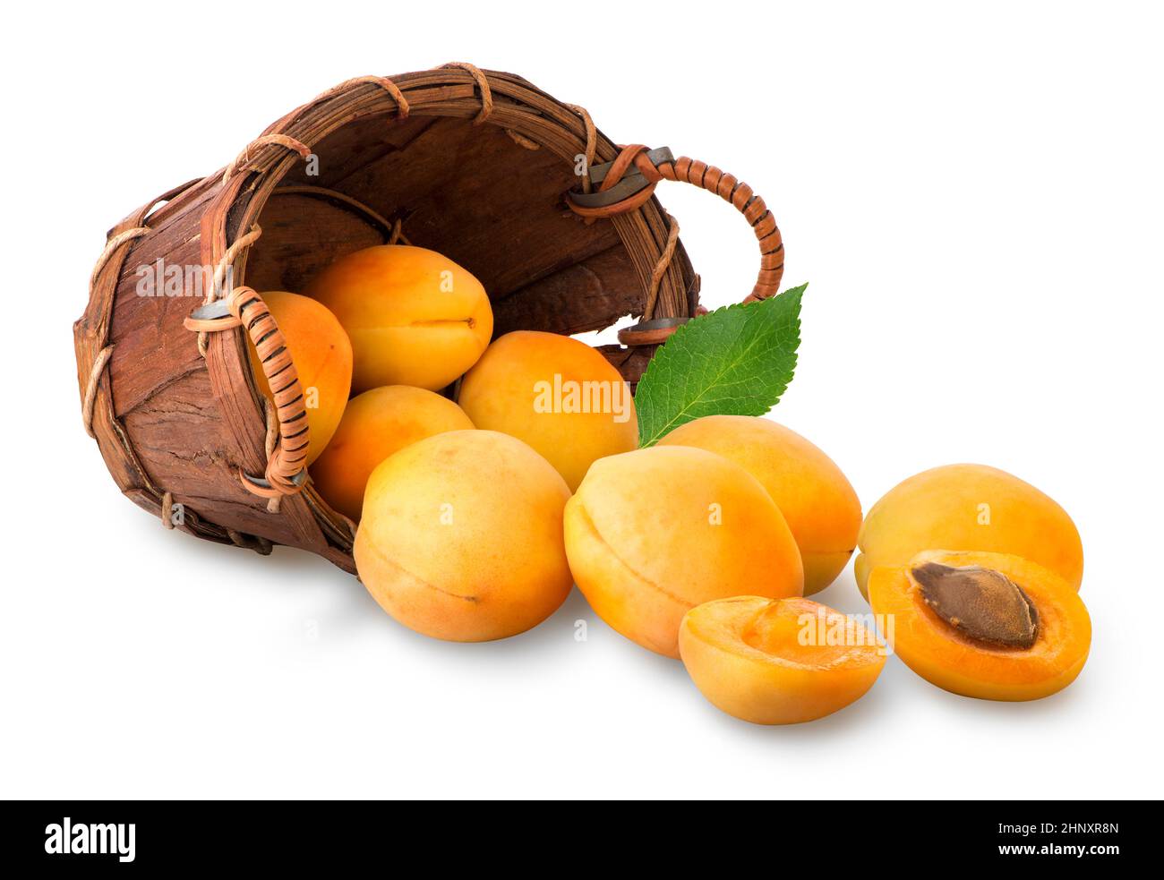 Juicy apricots in basket isolated on a white background Stock Photo - Alamy