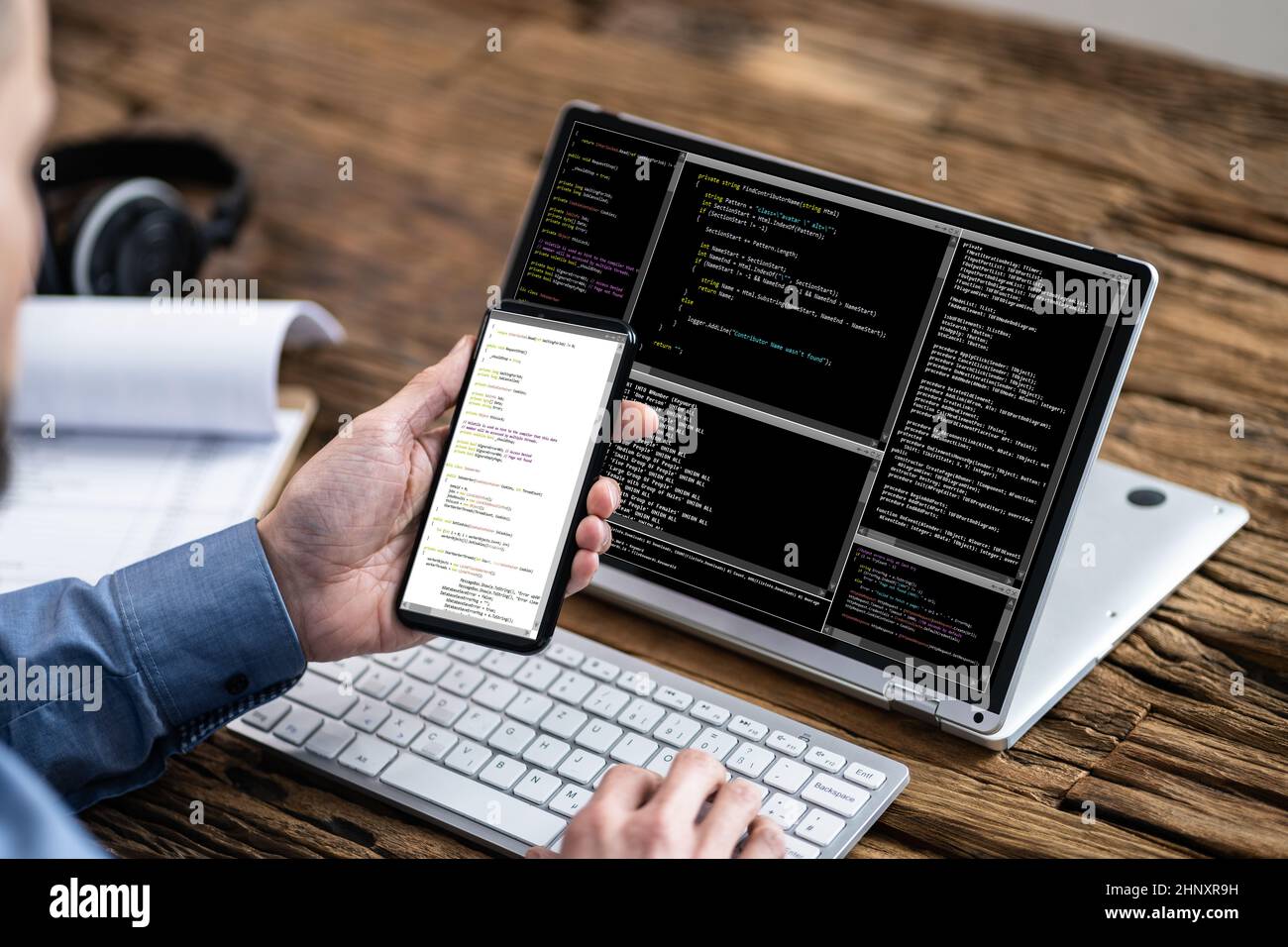 Programmer Coding On Laptop And Smartphone. Mobile Developer Stock ...