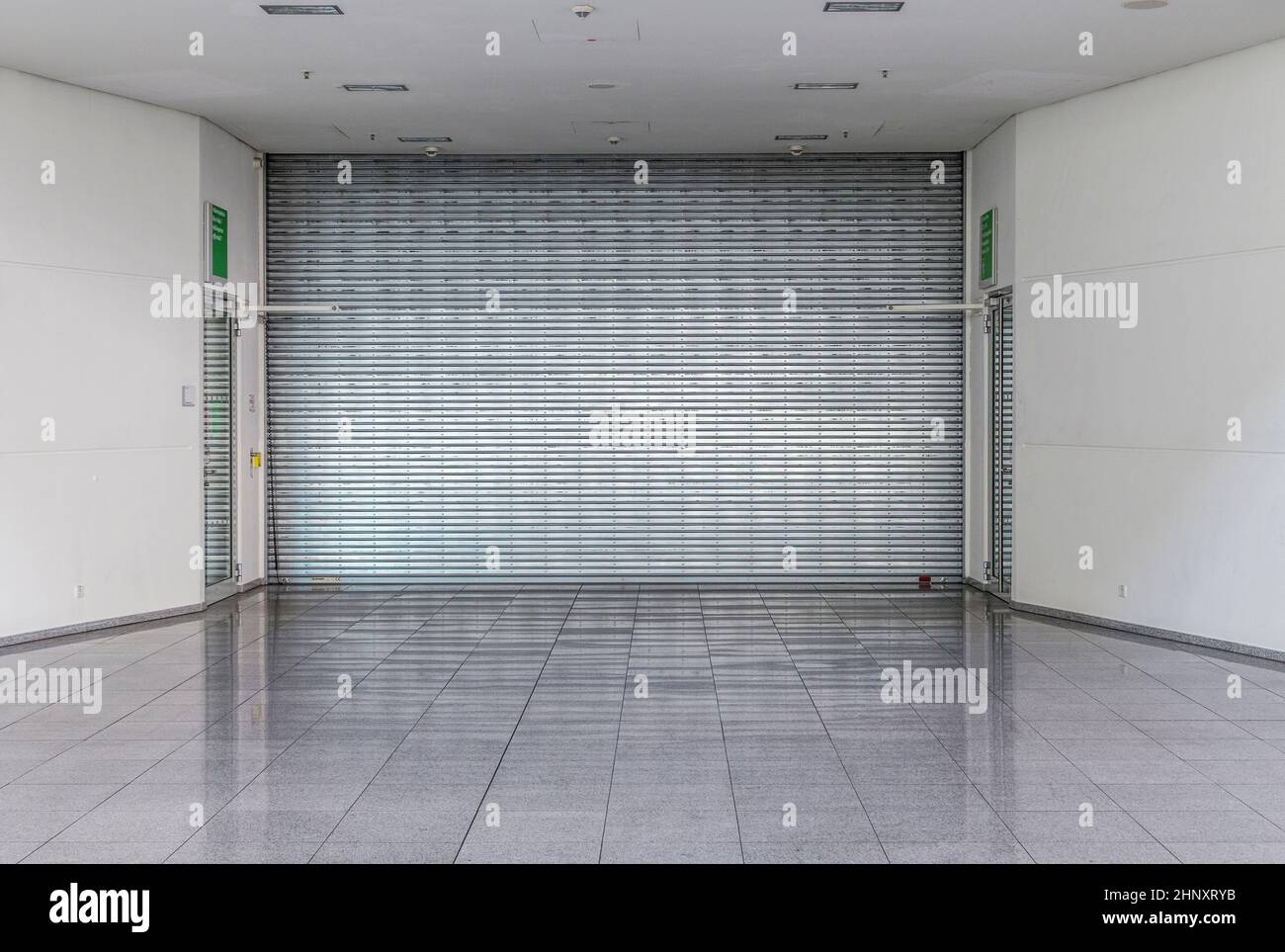 closed roller shutter at a shop without people Stock Photo - Alamy