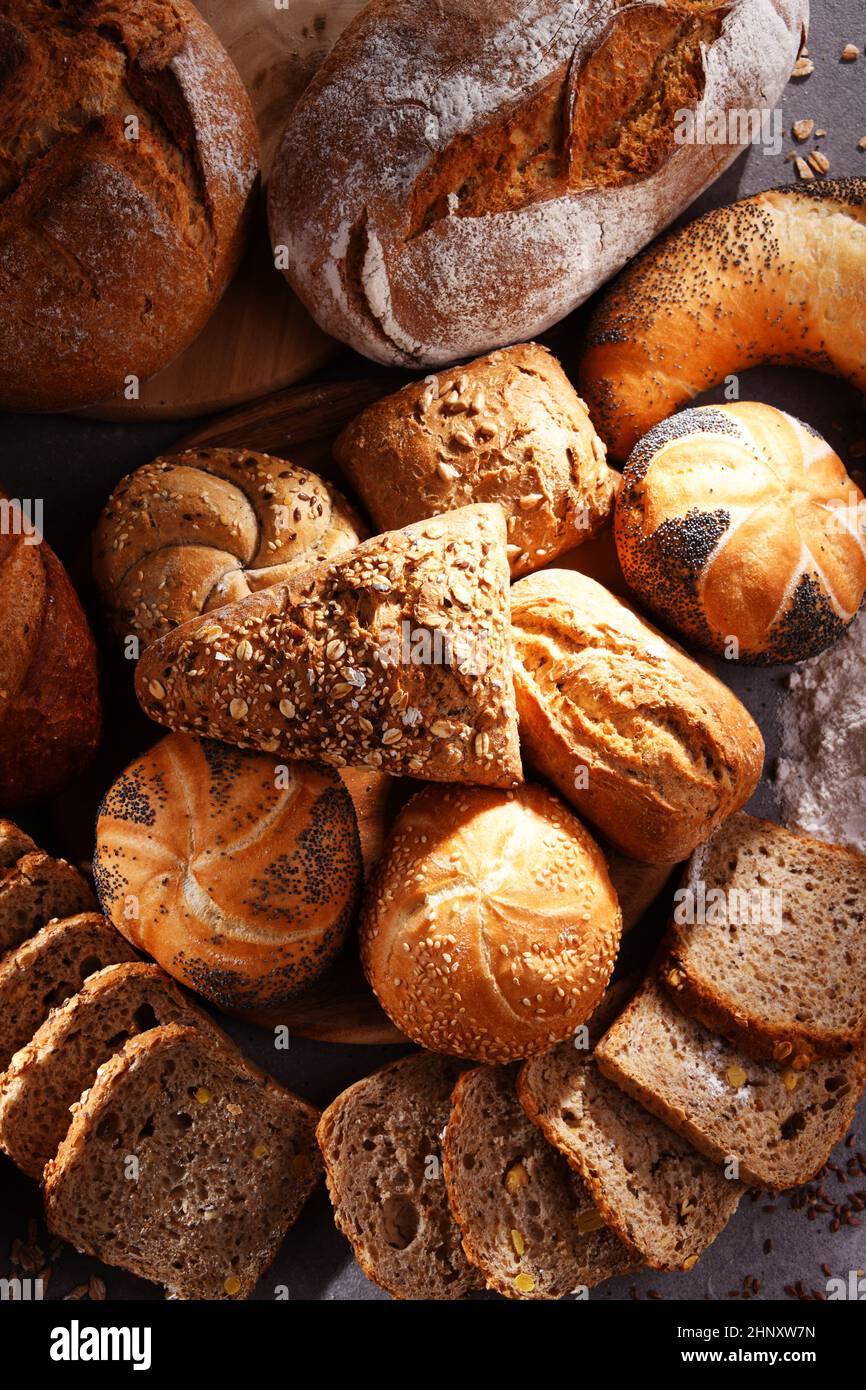 Assorted bakery products including loafs of bread and rolls Stock Photo ...
