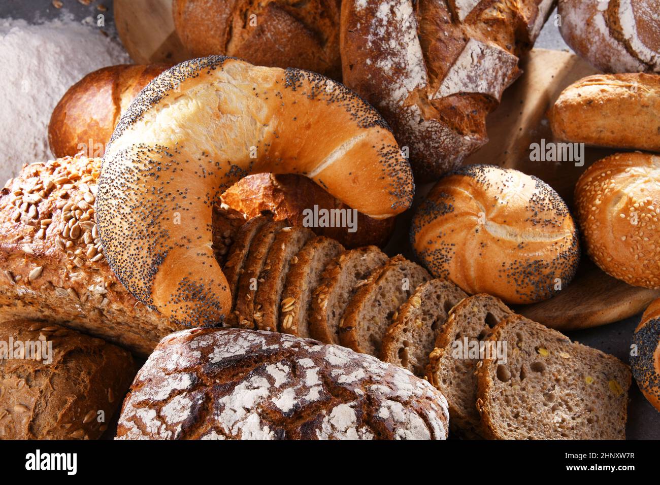 Assorted bakery products including loafs of bread and rolls Stock Photo ...