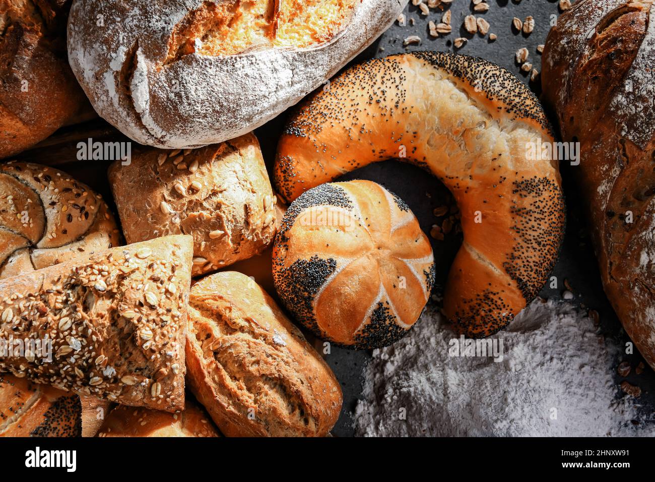 Assorted bakery products including loafs of bread and rolls Stock Photo ...