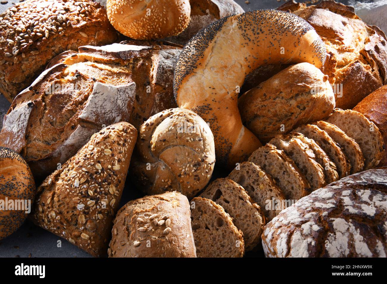 Assorted bakery products including loafs of bread and rolls Stock Photo ...