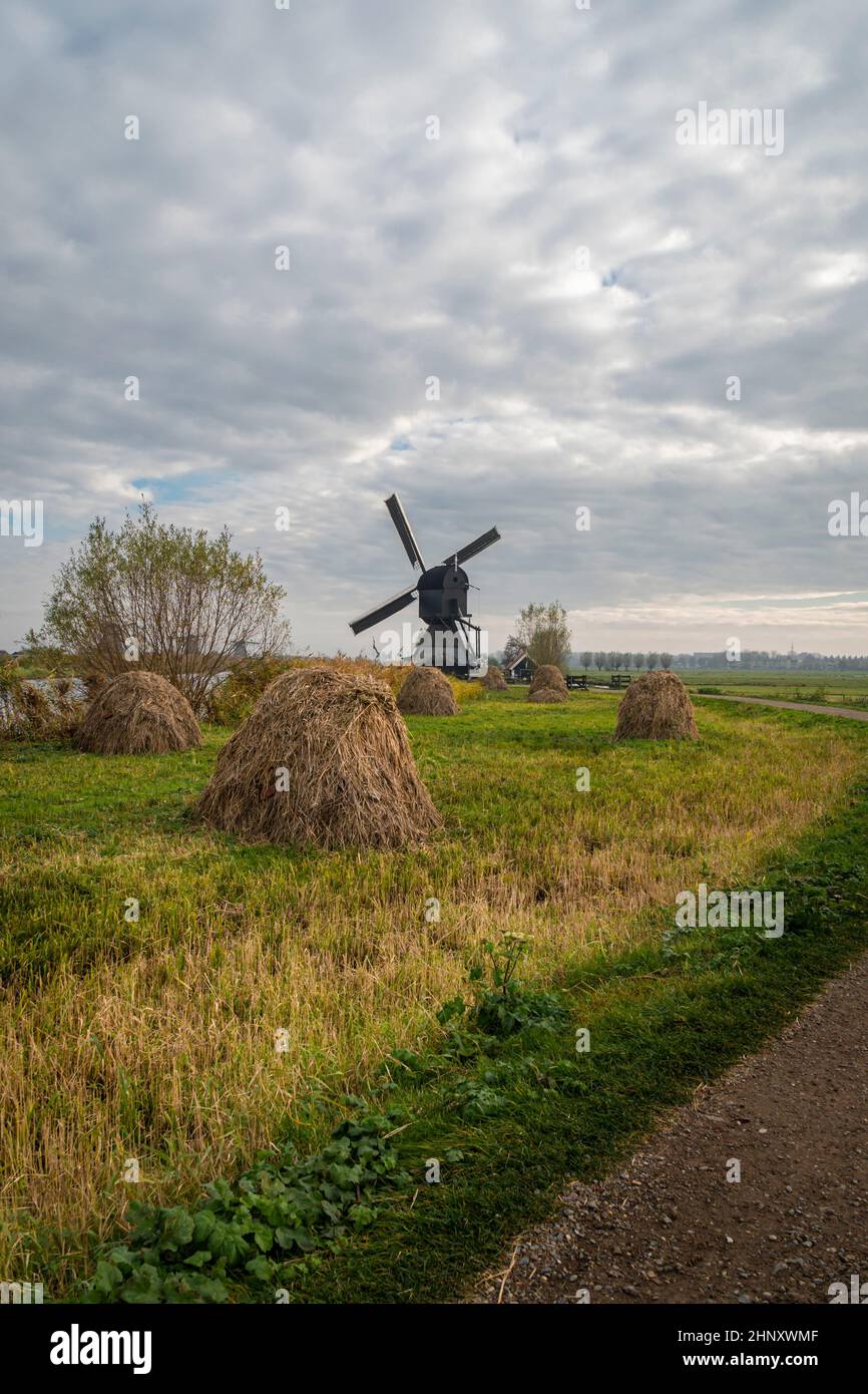 Hay bales and windmill hi-res stock photography and images - Alamy