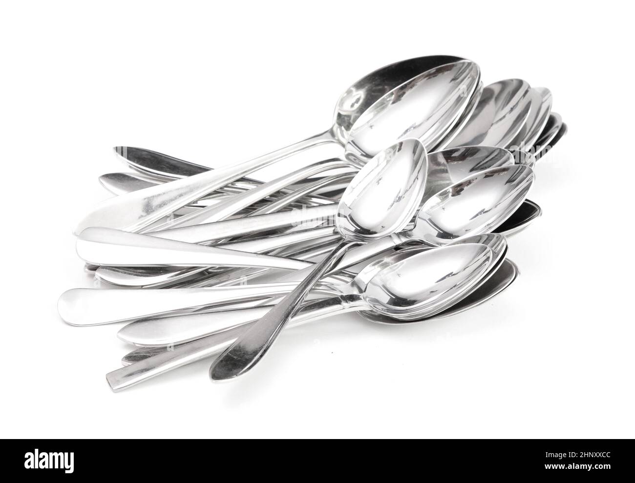 Pile of old metal spoons, isolated on white Stock Photo - Alamy