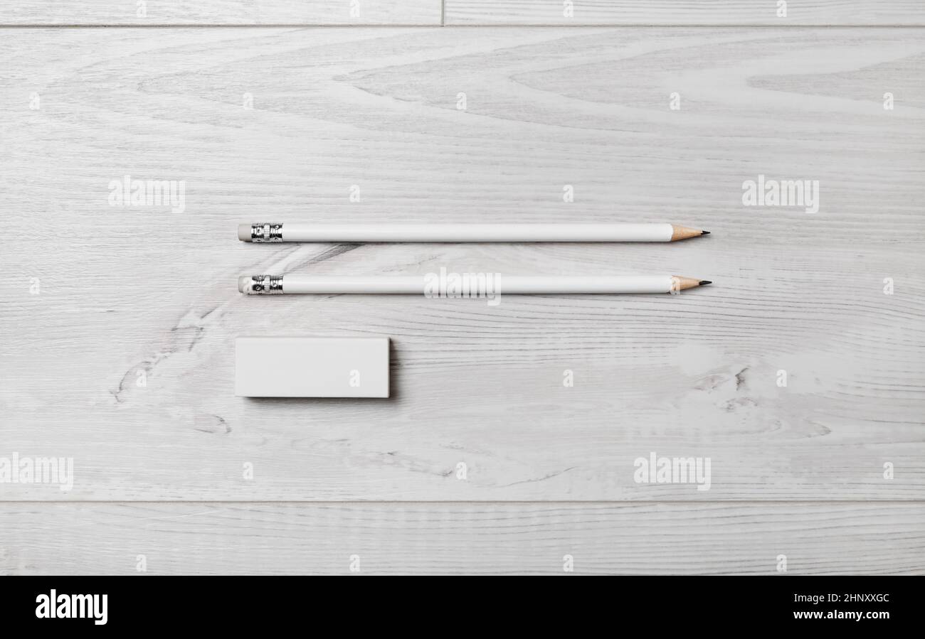 Two blank pencils and eraser on wooden background. Flat lay Stock Photo ...