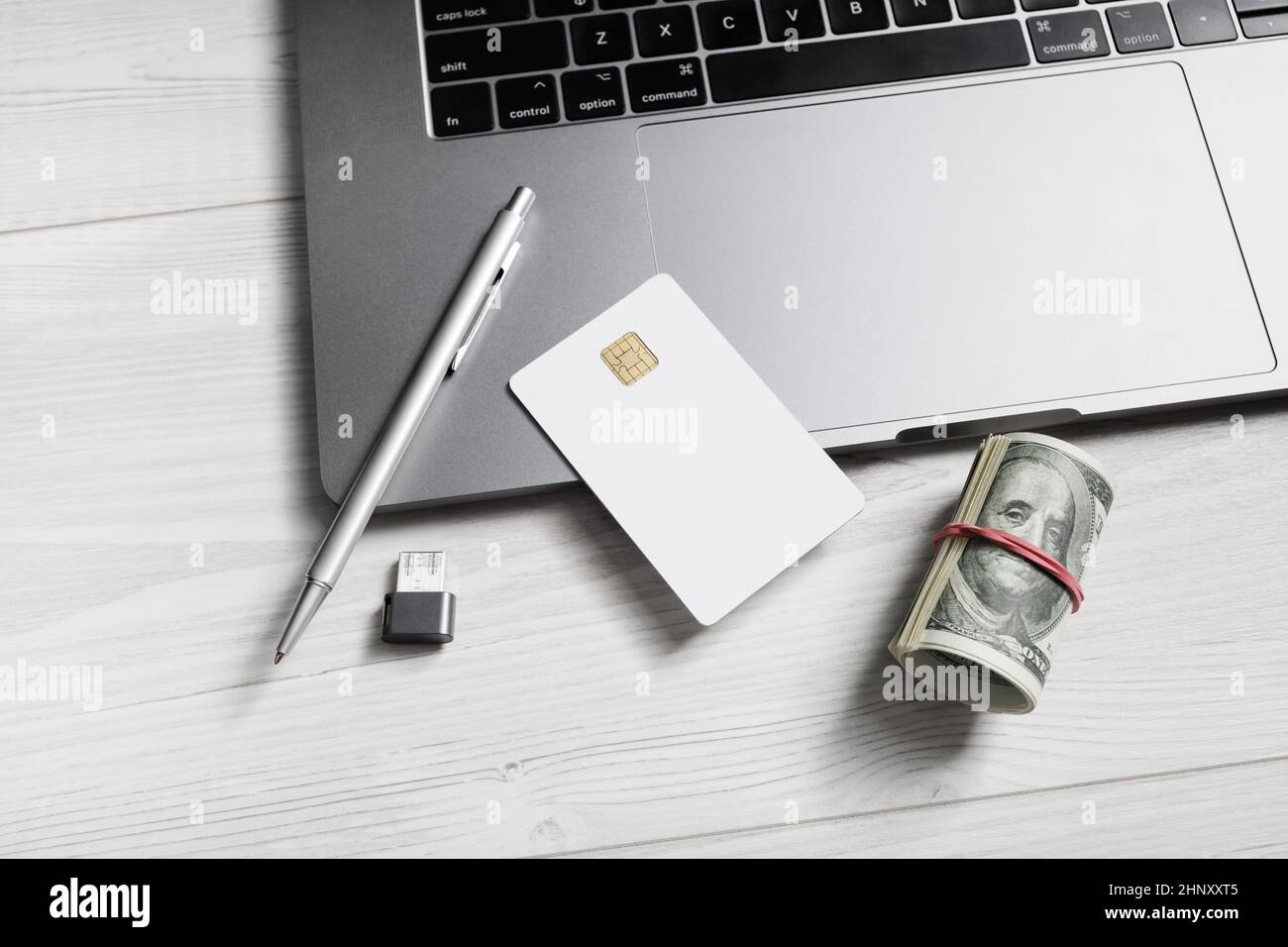 Online business concept. Money, blank credit card, pen, flash drive and ...
