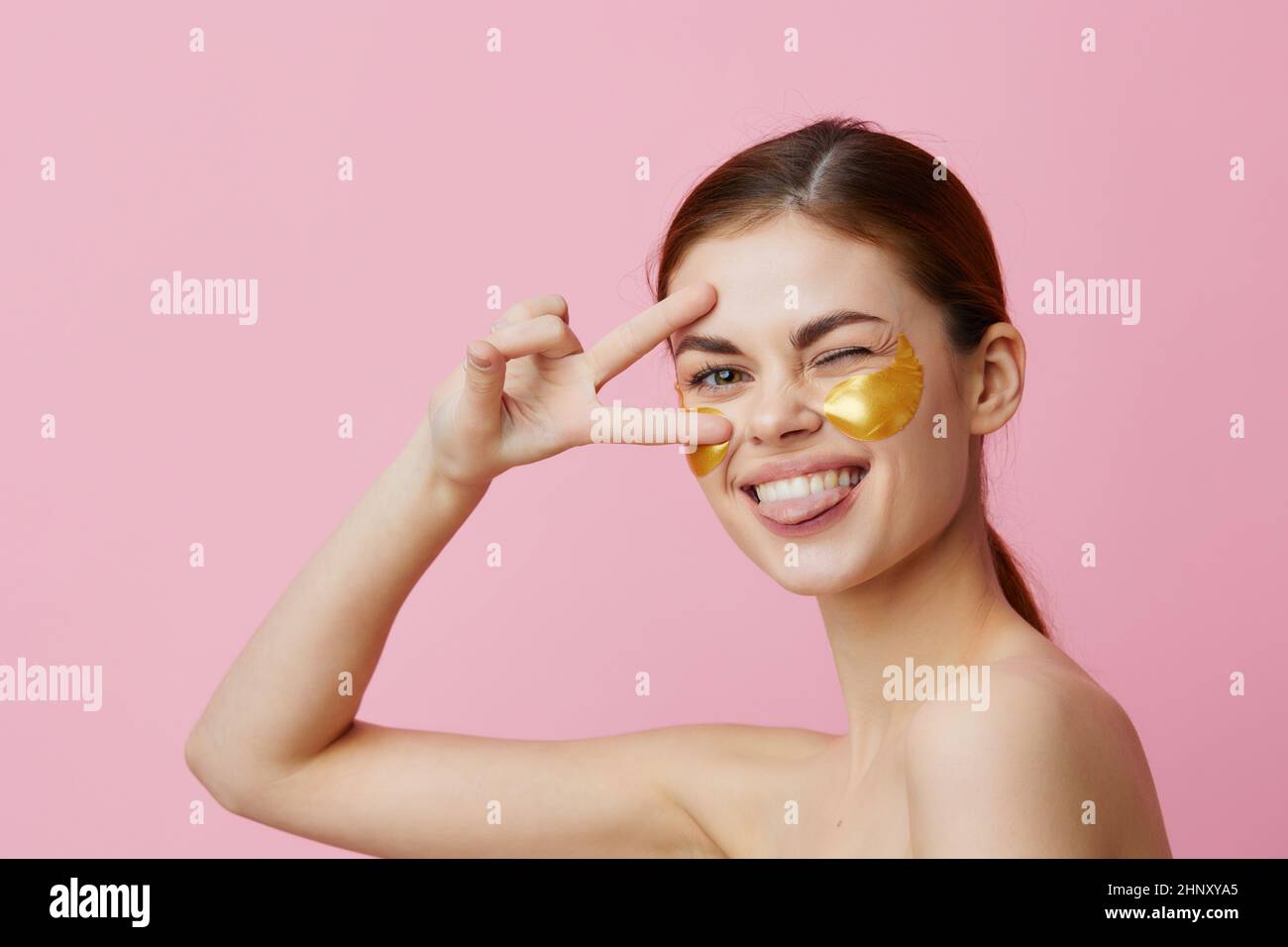 young woman patches rejuvenation skin care fun after shower close-up ...