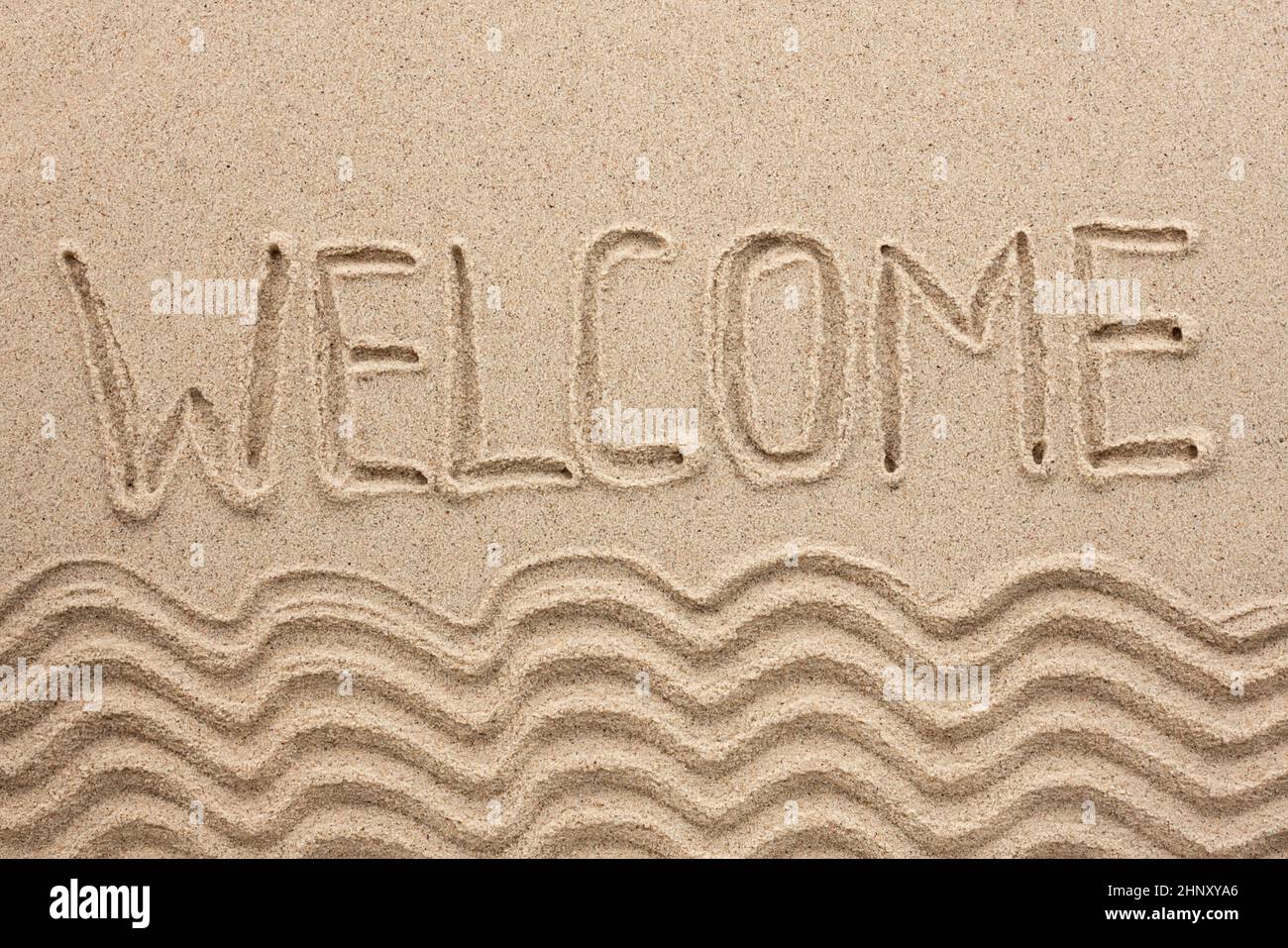 Welcome texture on sand hi-res stock photography and images - Alamy