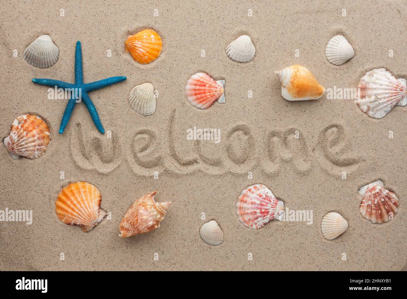 Word welcome written on the sand as the background Stock Photo - Alamy