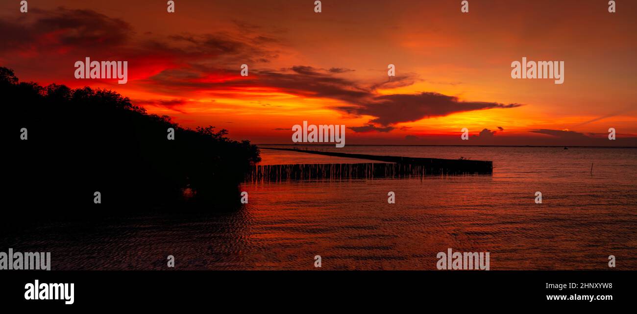 Beautiful red and orange sunset sky over the tropical sea. Red sunset ...