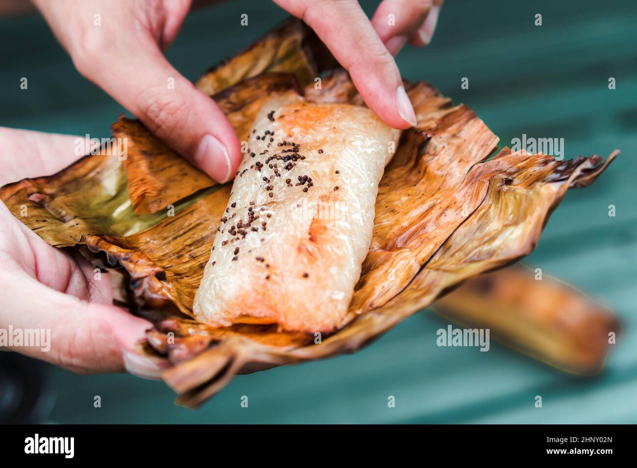 Thai traditional dessert. Grilled Taro Stuffed Coconut Sticky Rice ...