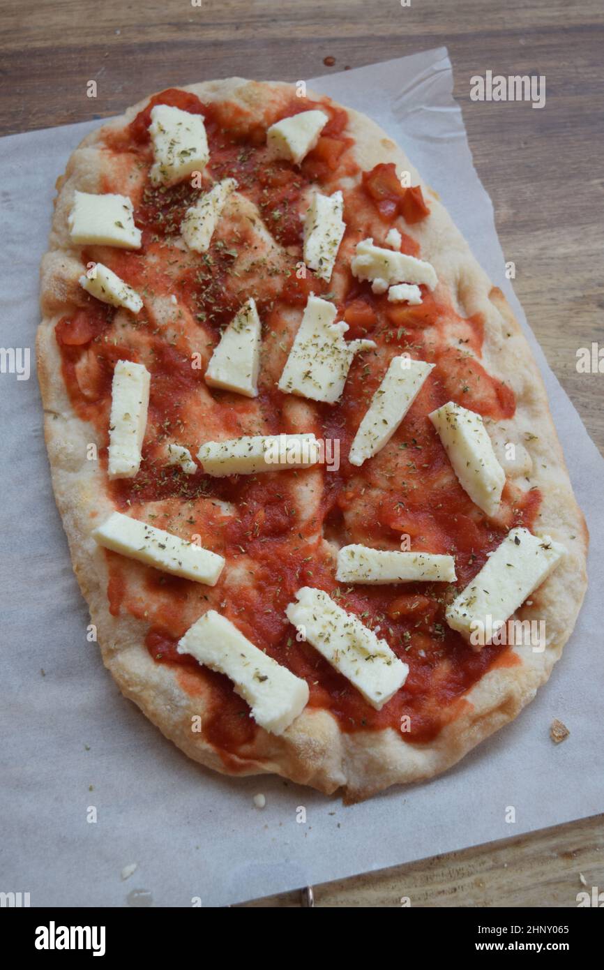 homemade pizza with mozzarella cheese and tomato puree Stock Photo - Alamy