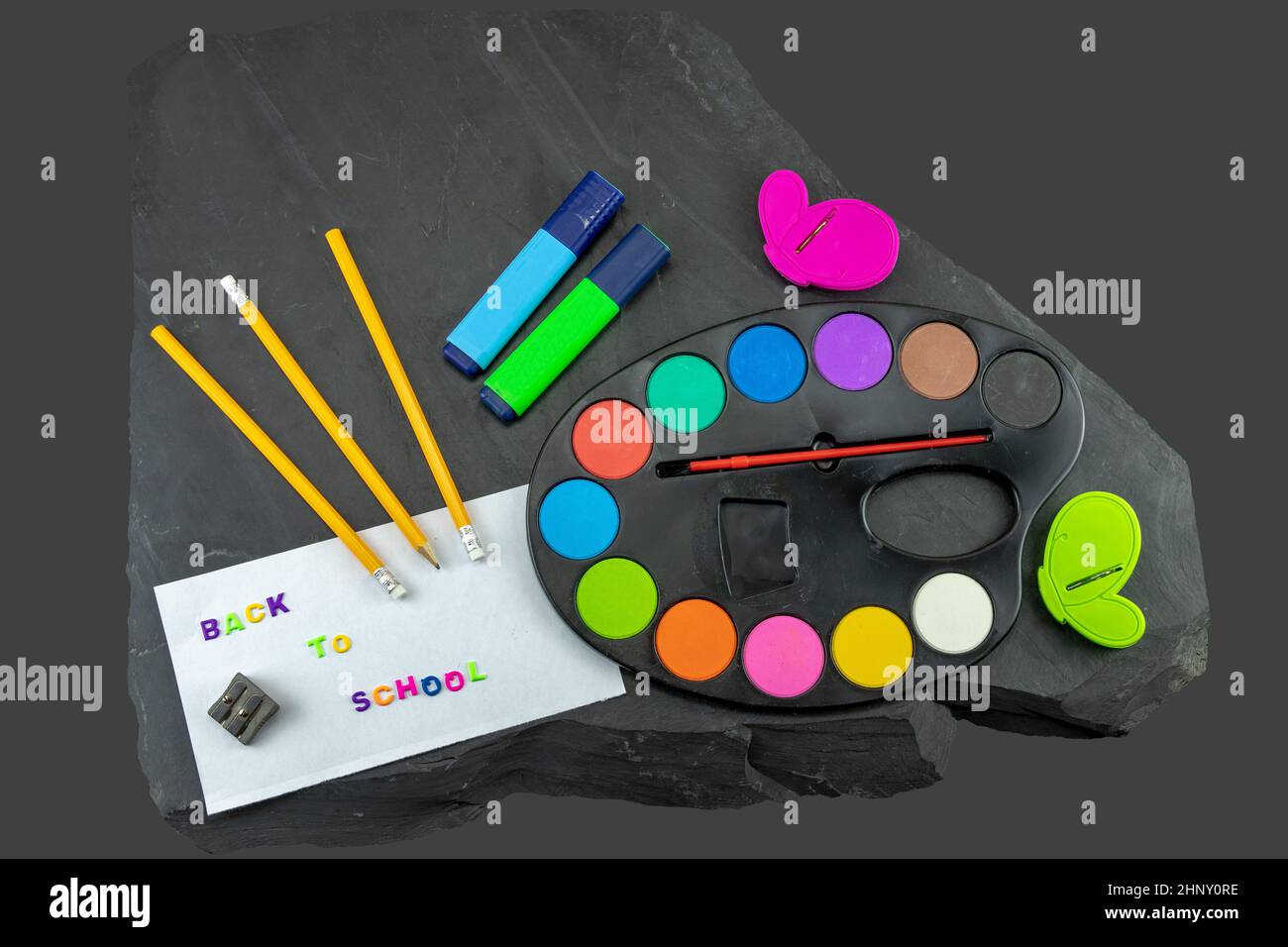 Closeup of colorful school supplies with copy space on blackboard ...