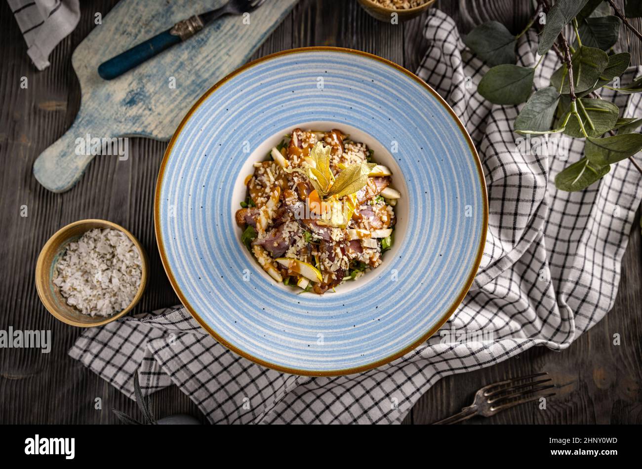 Flat lay of fresh salad with ham and pear. Still life food concept ...