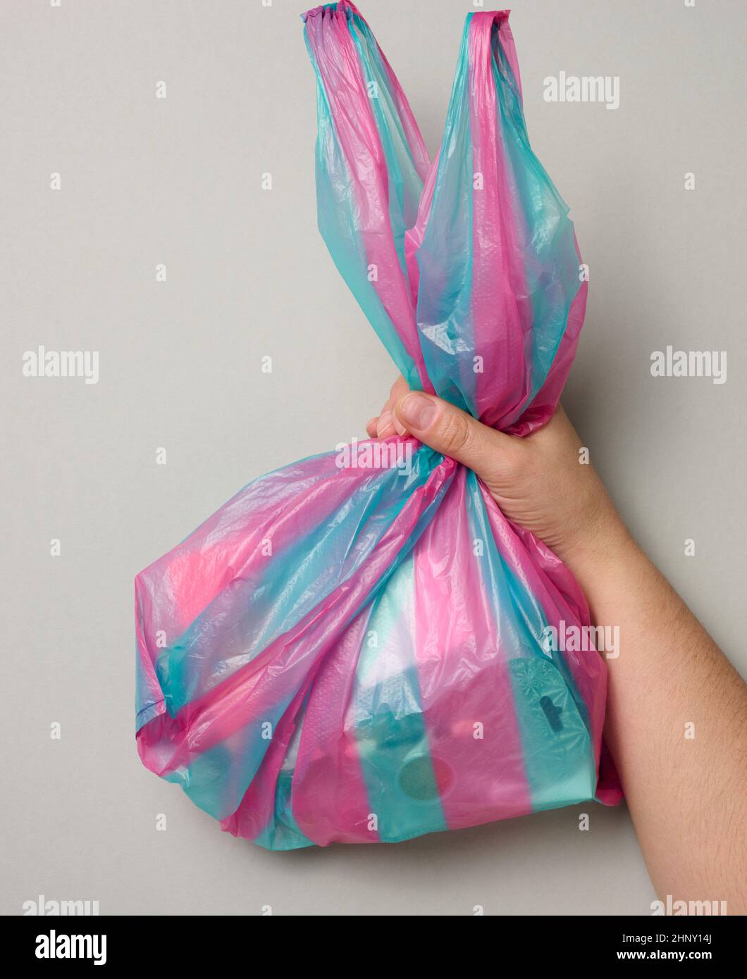 Hand full plastic rubbish hi-res stock photography and images - Alamy
