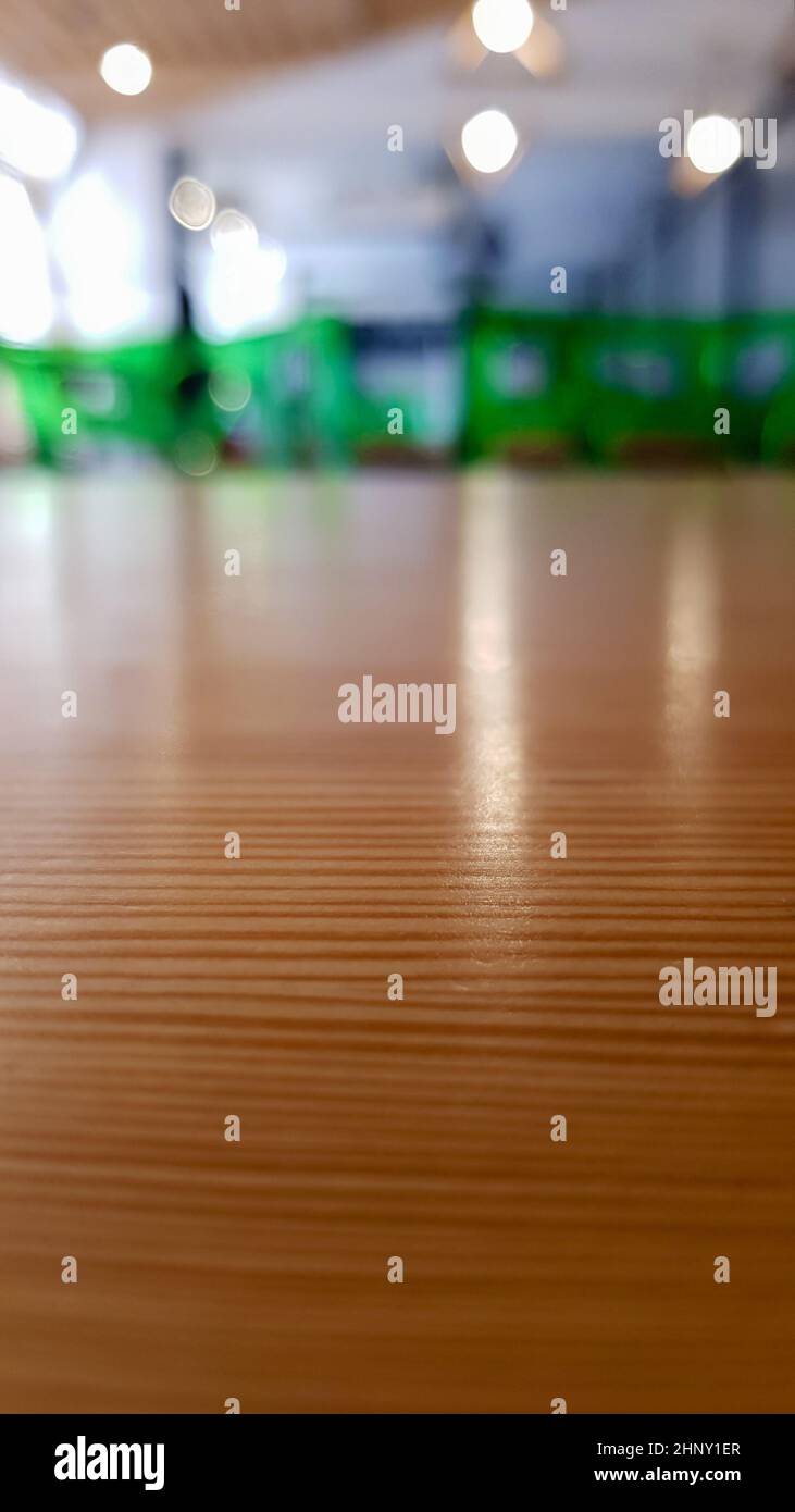 Cafeteria, no people dining room with wooden tables and green chairs ...