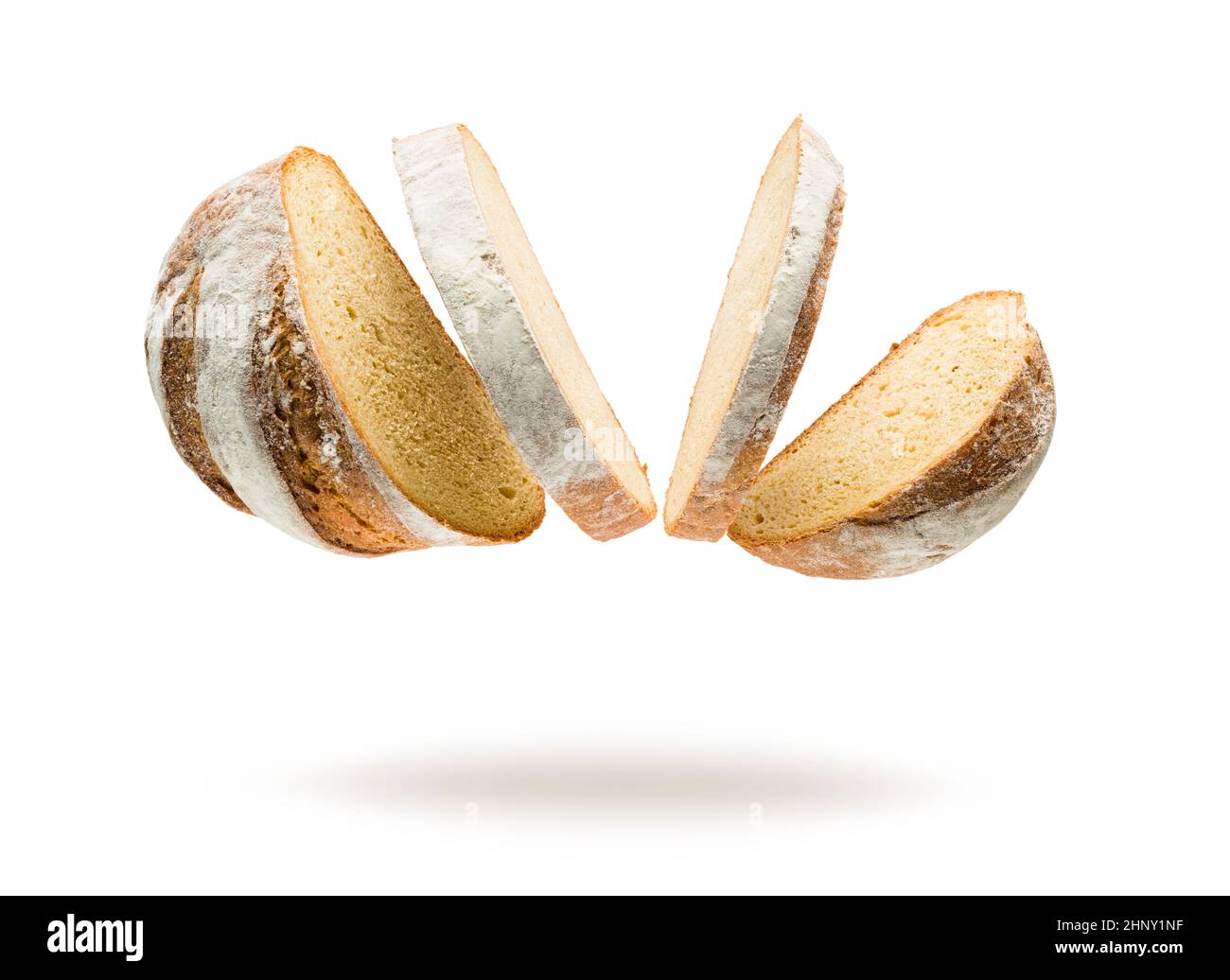 Fresh loaf of bread sliced floating on white background Stock Photo - Alamy