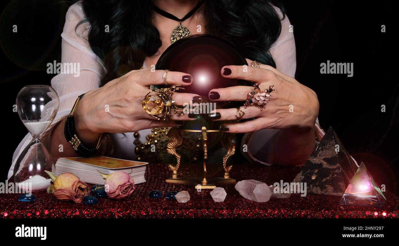 Female Psychic with crystal ball and tarot cards, Shallow DOF Stock ...
