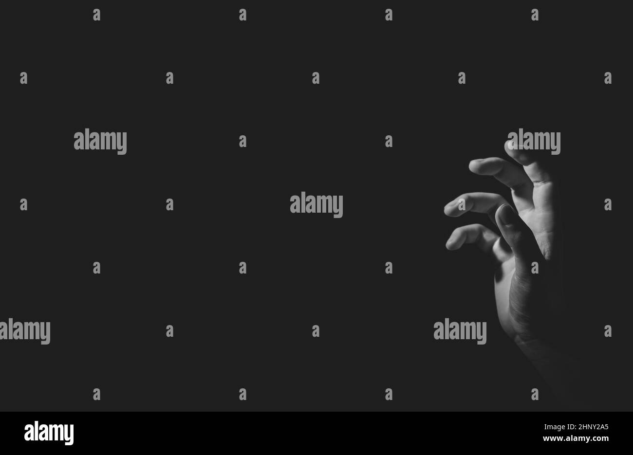 Hand with light and shadow, black an white, isolated on black Stock ...