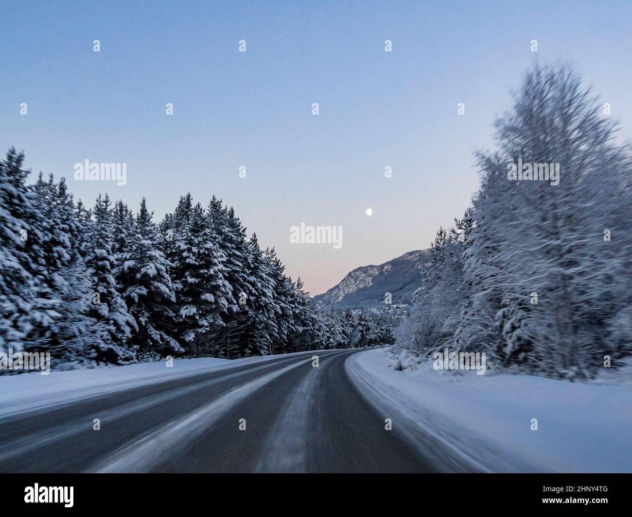 Driving fast at night through mountains and forests in Norway Stock ...