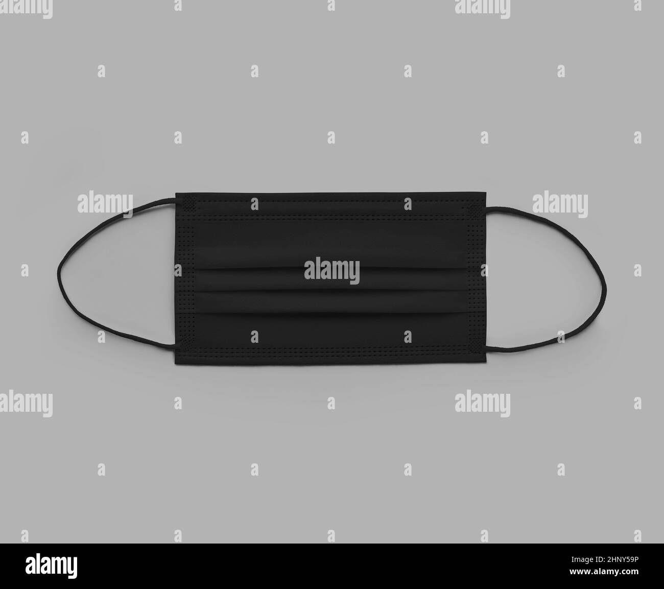 Mockup of a black surgical mask with ear loops, with space for design ...