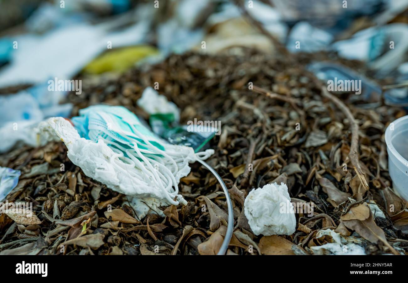 Used face mask discard in household garbage. Medical waste disposal ...