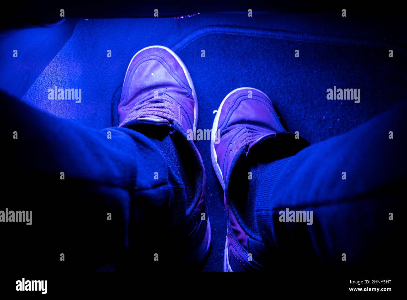 Detail of Colorful light night shoes in the dark Stock Photo - Alamy