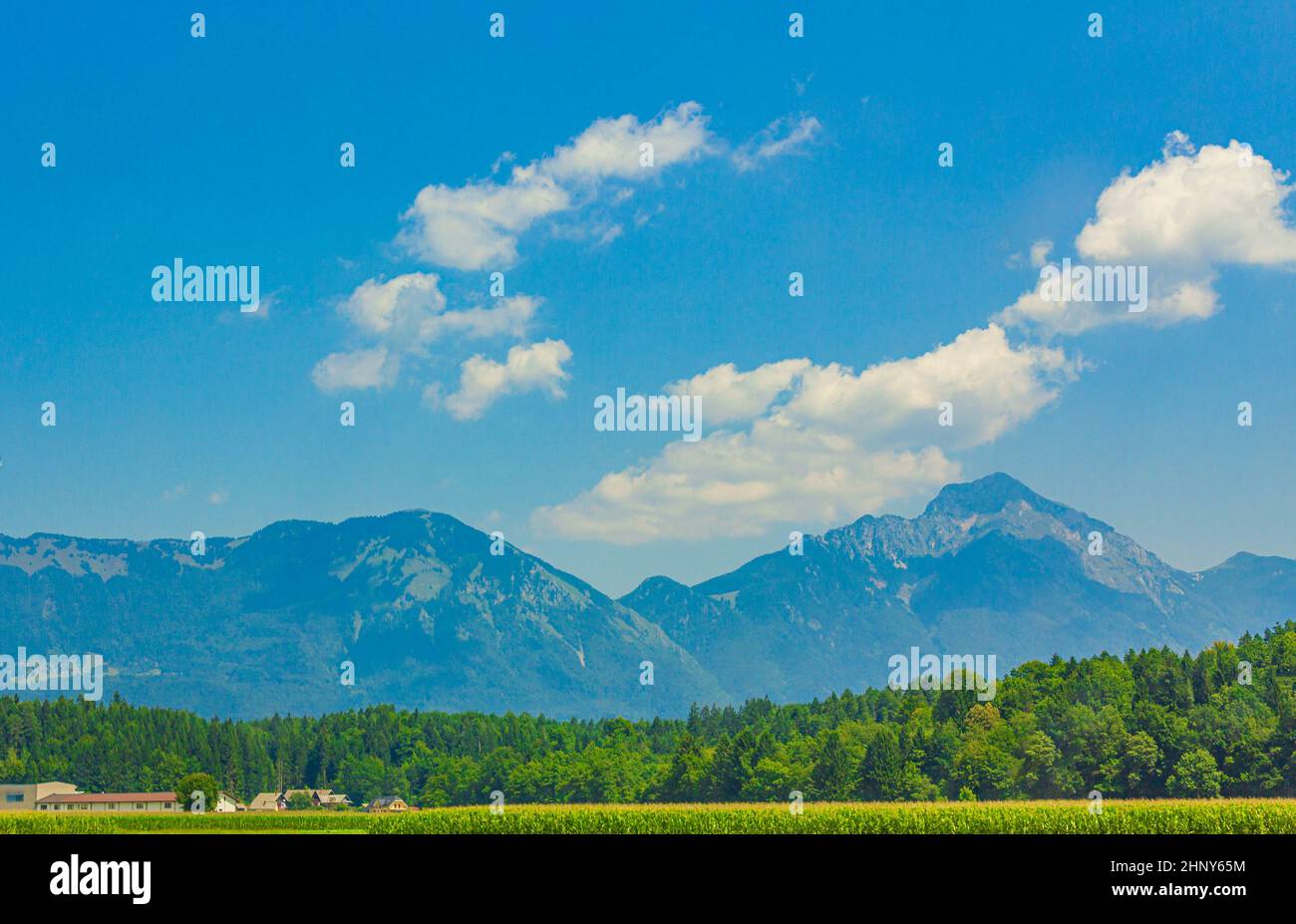 Wonderful mountain and forest landscape with an idyllic village in ...