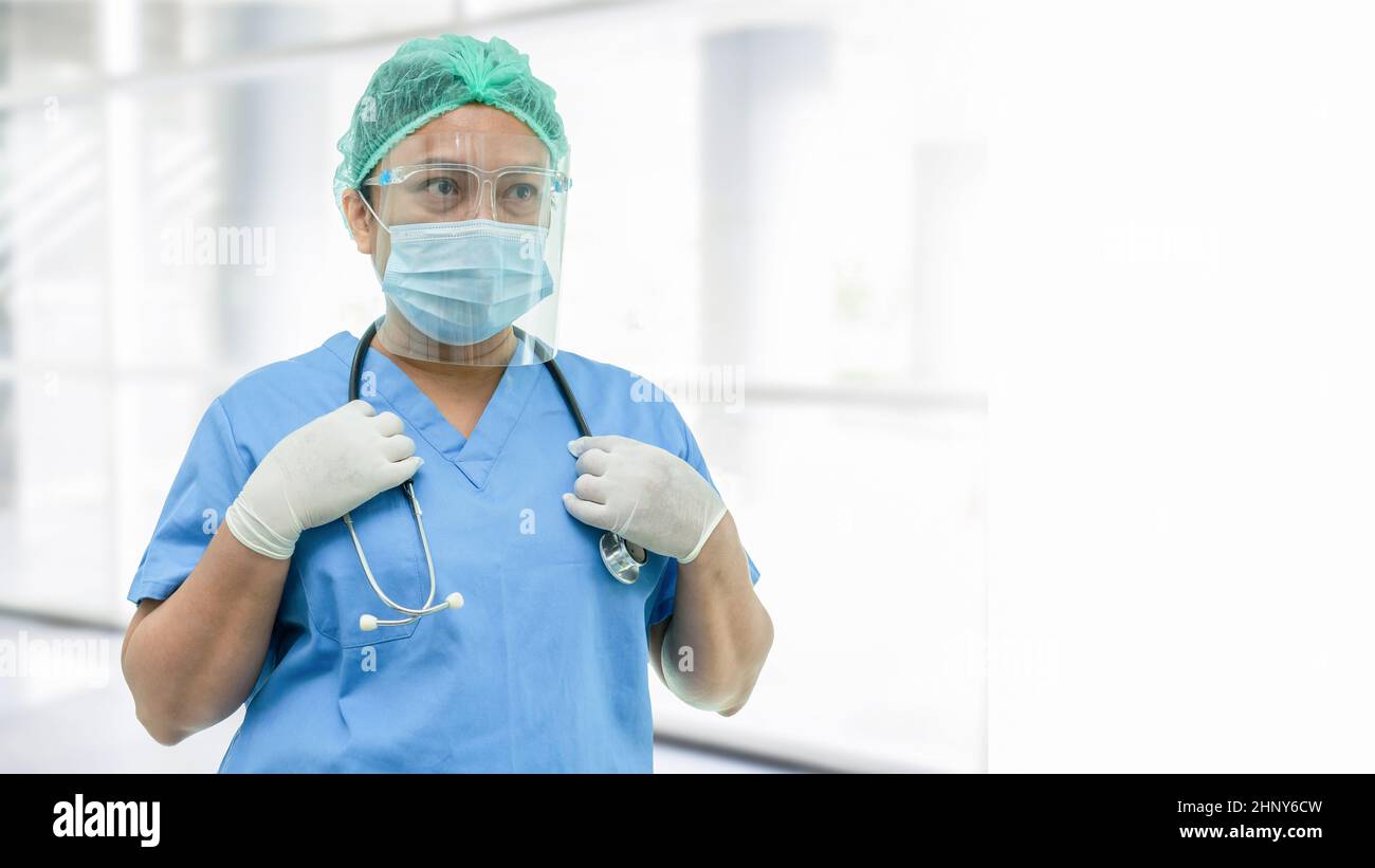 Asian doctor wearing face shield and PPE suit new normal to check ...