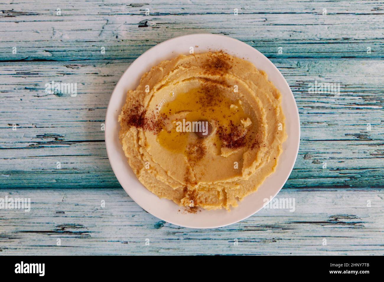 Hummus from Palestine with olive Stock Photo - Alamy