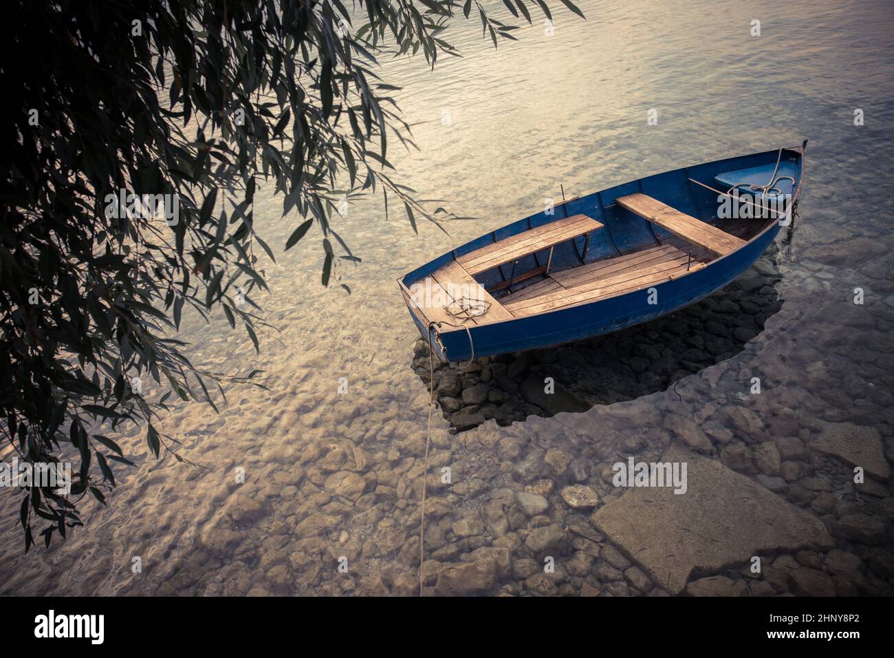 High angle image of a empty wooden boat floating on water Stock Photo ...