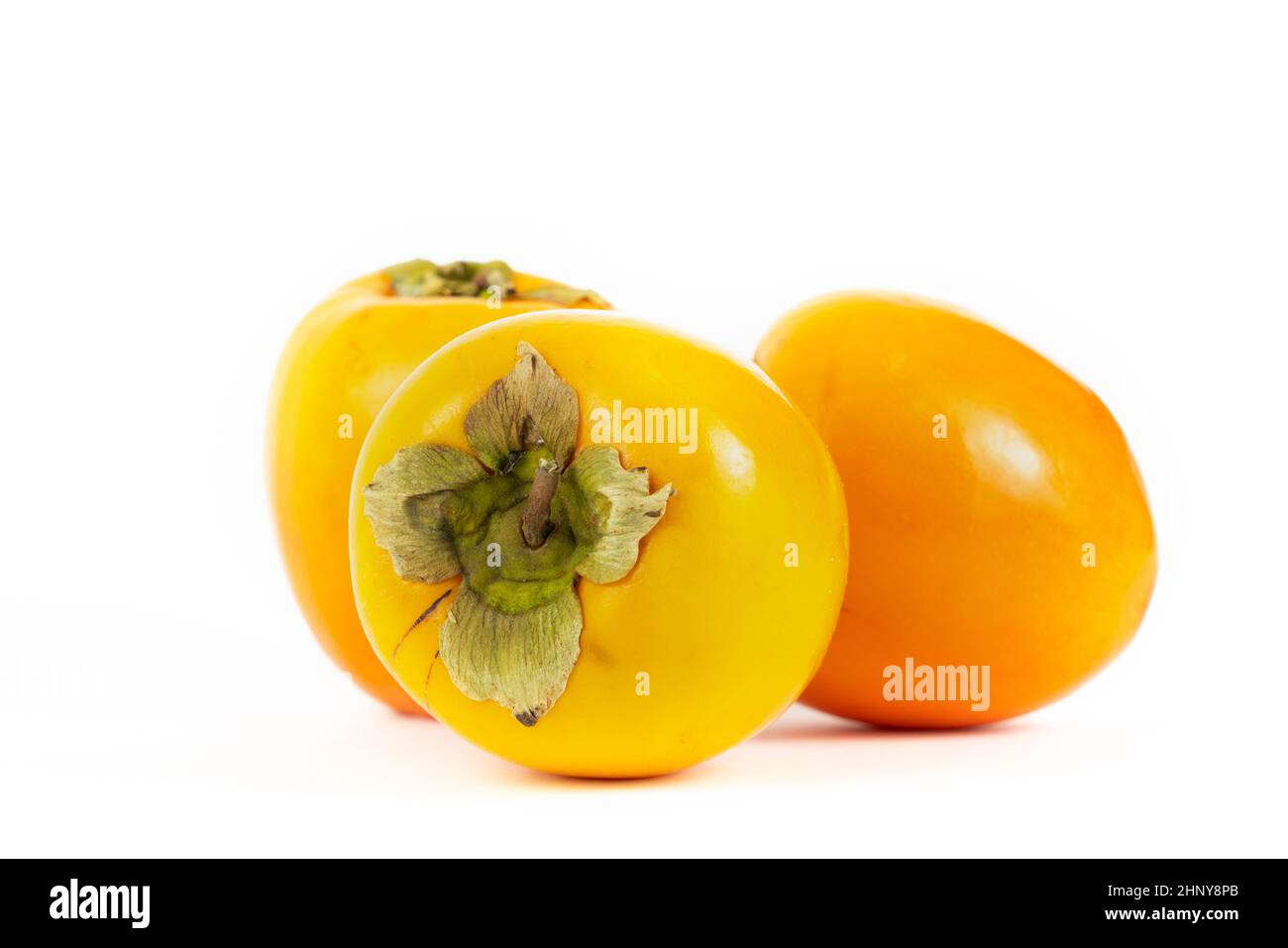 Group of three fresh delicious kaki fruit isolated on white Stock Photo ...