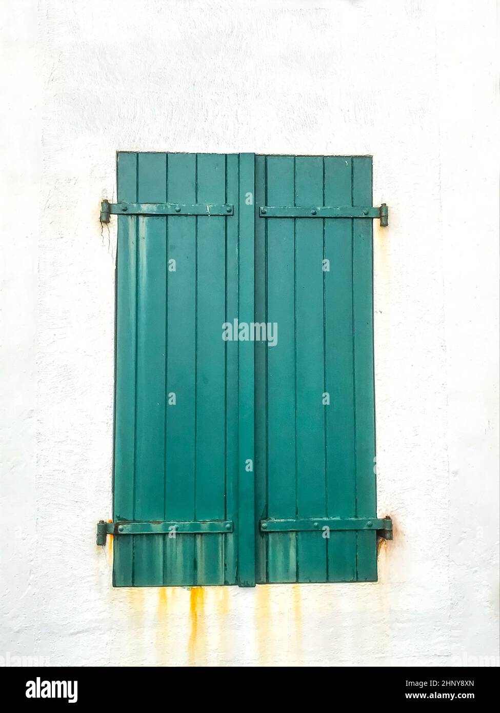 Old wooden green shutter on a white house facade Stock Photo - Alamy