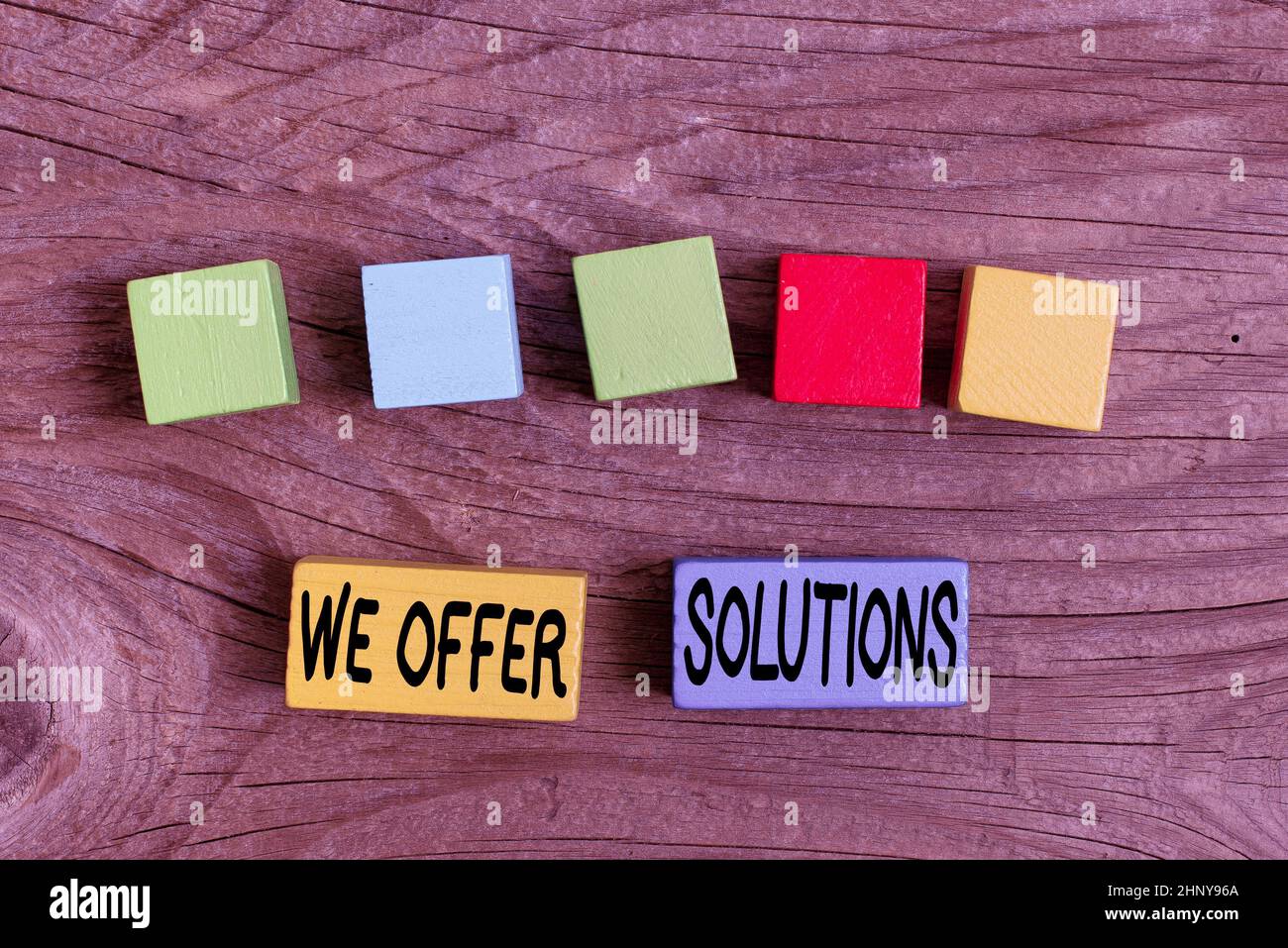 Sign displaying We Offer Solutions, Word Written on way to solve ...