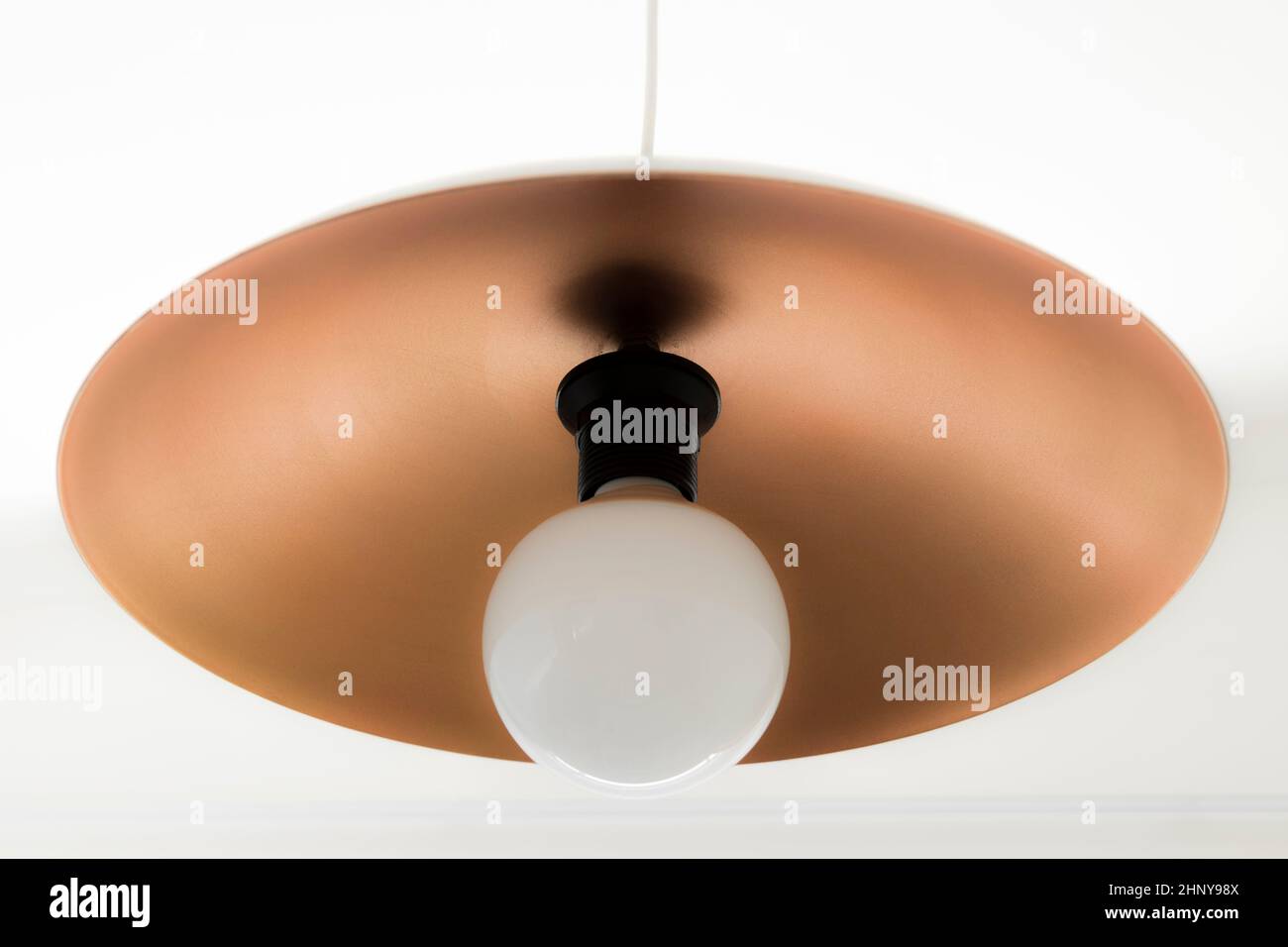 Lamp with light bulb, bronze metallic look. White background Stock ...