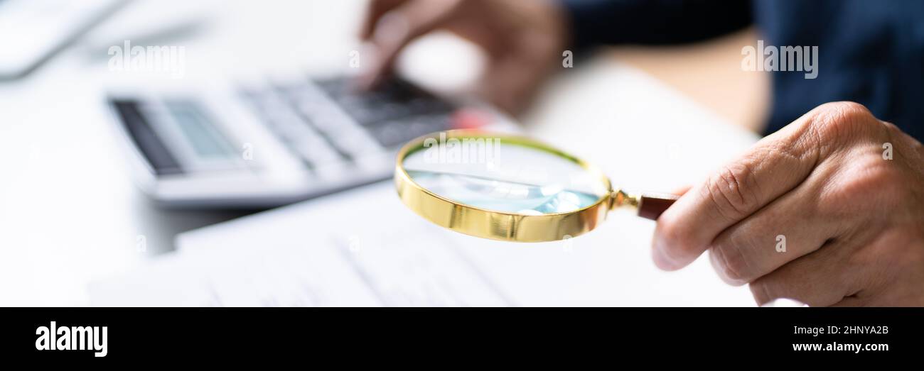 Auditor Using Magnifying Glass For Audit And Fraud Investigation Stock ...