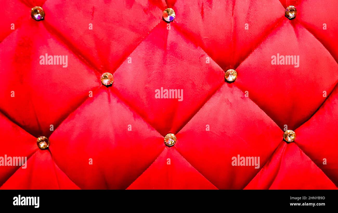back of a red sofa. Red fabric texture background, Chesterfield style ...