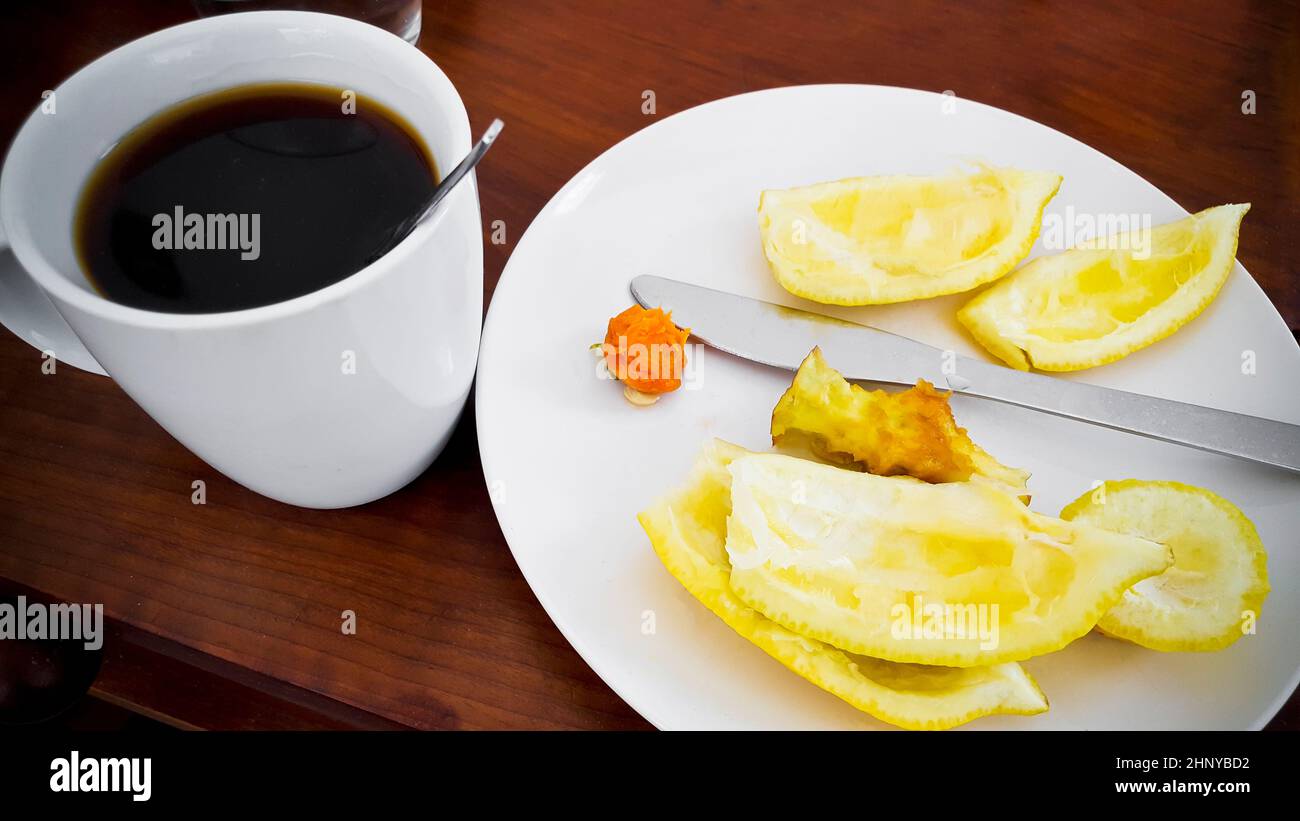 Finish eating fruits and starting drinking black coffee. Food and Drink ...