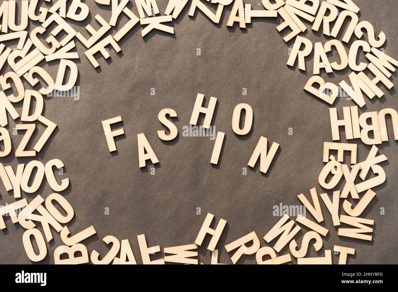 Fashion Word In Wooden Cube Alphabet Letters Top View On A rustic paper ...