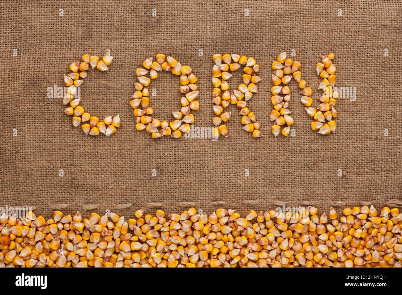 Word corn written on burlap , background Stock Photo - Alamy